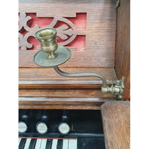 An Elgar & Co. oak cased Organ with pierced fret carving, 4ft W (R6)