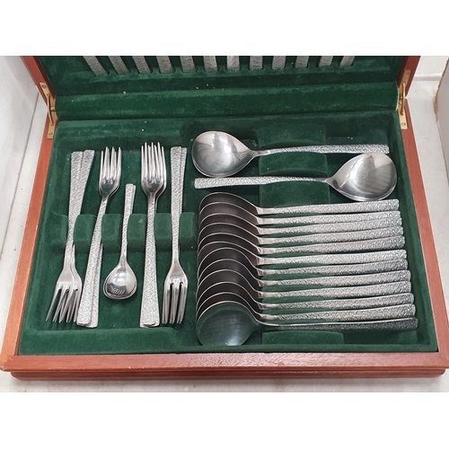A boxed stainless steel Cutlery Set, a set of brass and cast iron ...