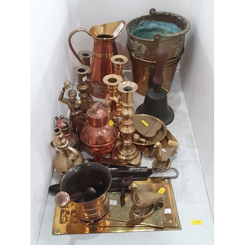 A collection of copper and brassware including Candlesticks, Jersey Cow, Jug, Bowls, Pestle and Mort