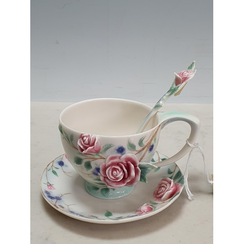 A Royal Doulton Franz Tea Cup, Saucer and Spoon with floral encrusted ...