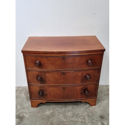 A 19th century mahogany bow fronted Chest of three drawers on bracket ...