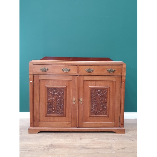 A small walnut Sideboard fitted two drawers above a pair of carved ...