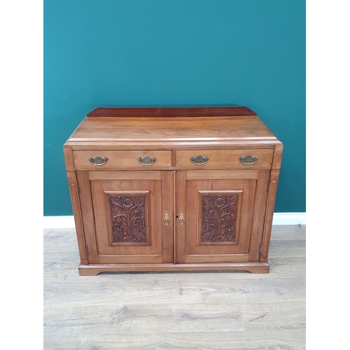 A small walnut Sideboard fitted two drawers above a pair of carved ...