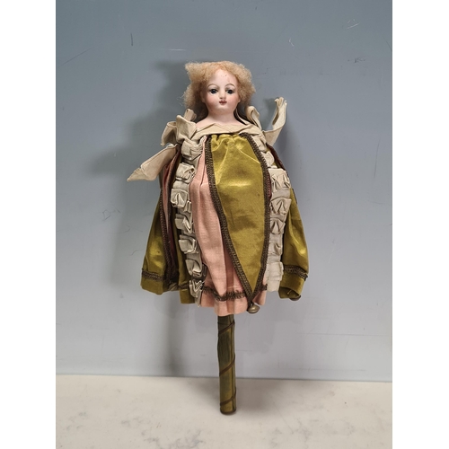 A Marotte revolving musical Doll with bisque head (R7)