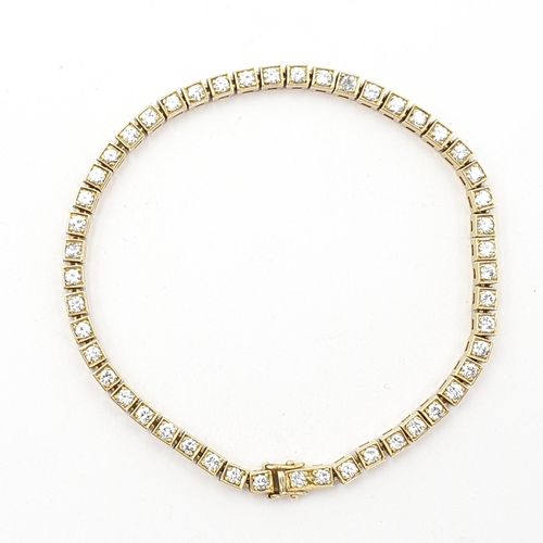 A Diamond-set Line Bracelet, 49 pavé-set round brilliant-cut diamonds ...