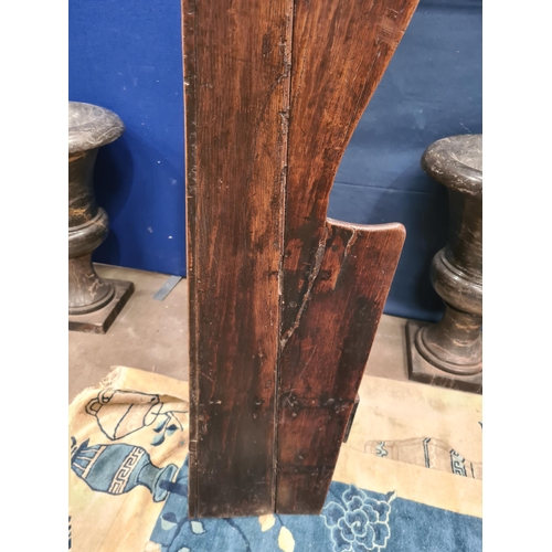 An 18th Century small oak wingback Settle fitted two drawers below the ...