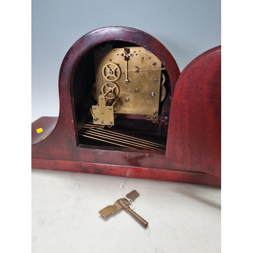 A German mahogany cased chiming Mantel Clock with circular dial and ...