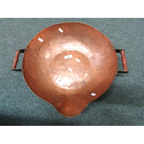 A large round copper two handled Pan with turned wooden grips 17in ...