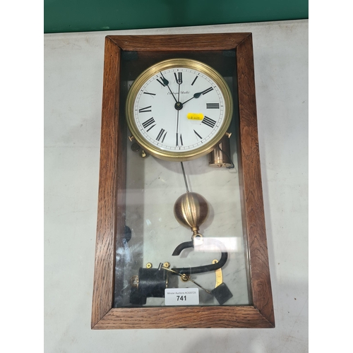 Electrique Bullie Wall Clock with circular dial marked with Roman ...