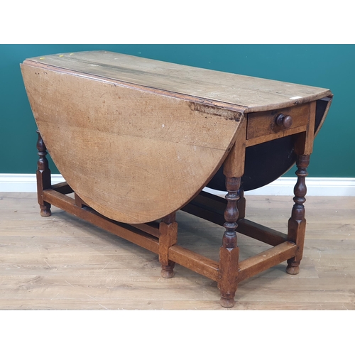 An early 18th Century oak Gateleg Table, with two fitted drawers and ...
