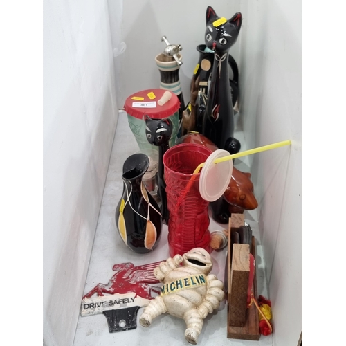 A pottery model of a Bear, a white painted Michelin Figure, 6in H, two ...