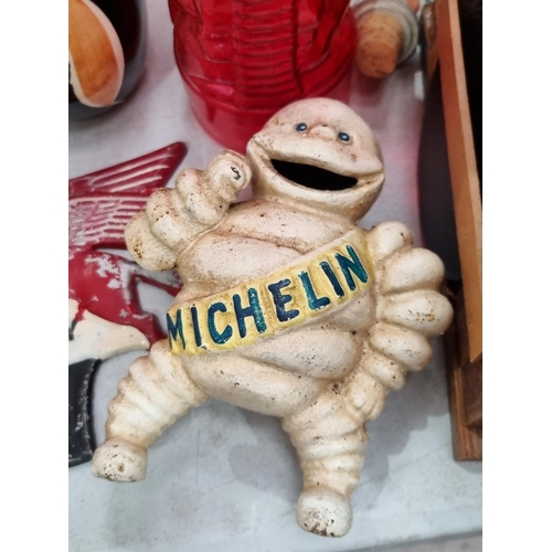 A pottery model of a Bear, a white painted Michelin Figure, 6in H, two ...