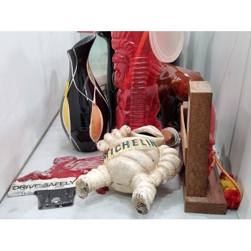 A pottery model of a Bear, a white painted Michelin Figure, 6in H, two ...