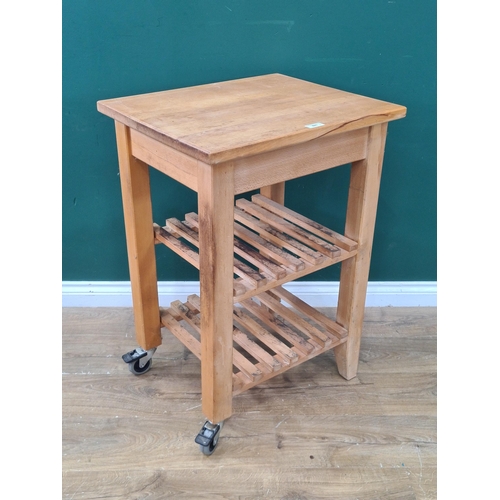 An Oak kitchen chopping block on wheels with storage below. (R9)