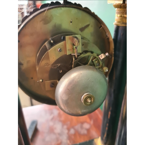 A black and gold mantel clock. (R6)