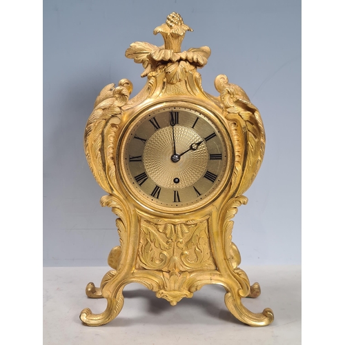 A French gilt metal Mantel Clock with pineapple finial above the ...