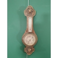A antique blood pressure machine and a barometer. (R2)