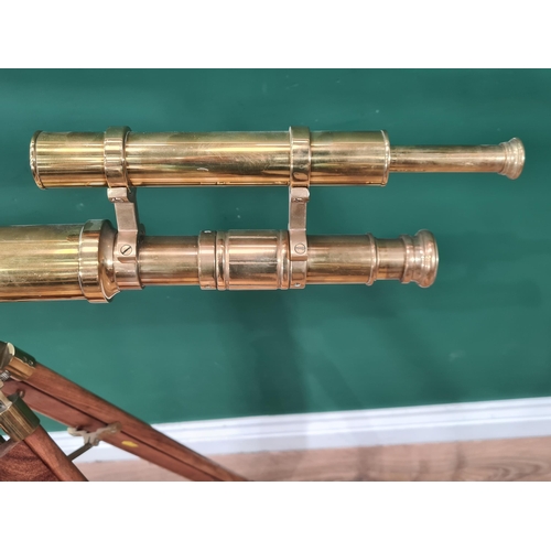 A Brass Telescope on wooden extendable tripod base. (R2)