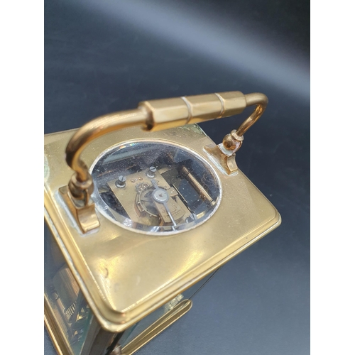 An early 19th century French brass cased Carriage Clock with white ...