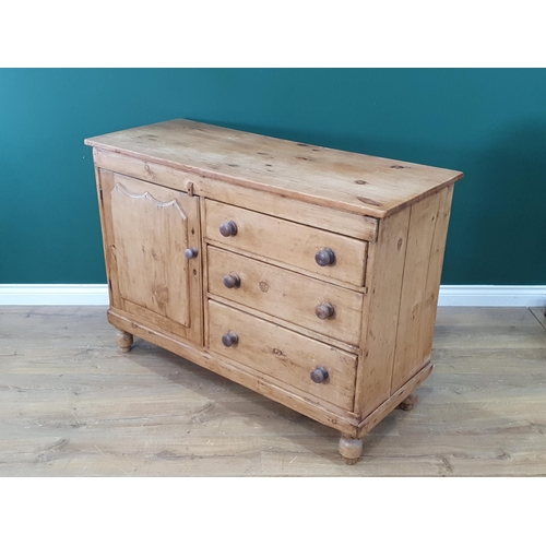 A small pine Sideboard fitted three drawers and a cupboard door on ...