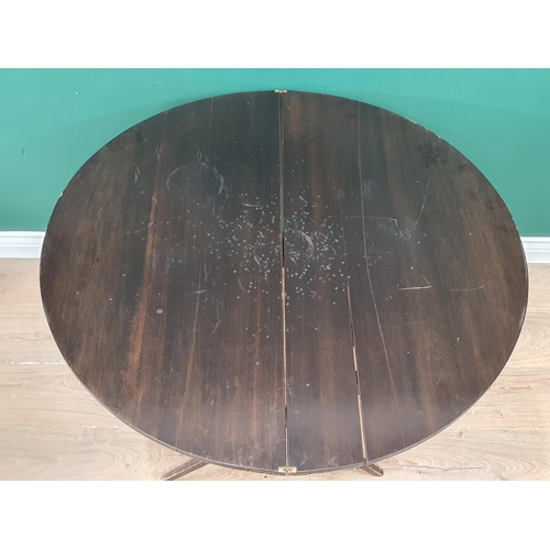 An Oak folding circular table. (R8)