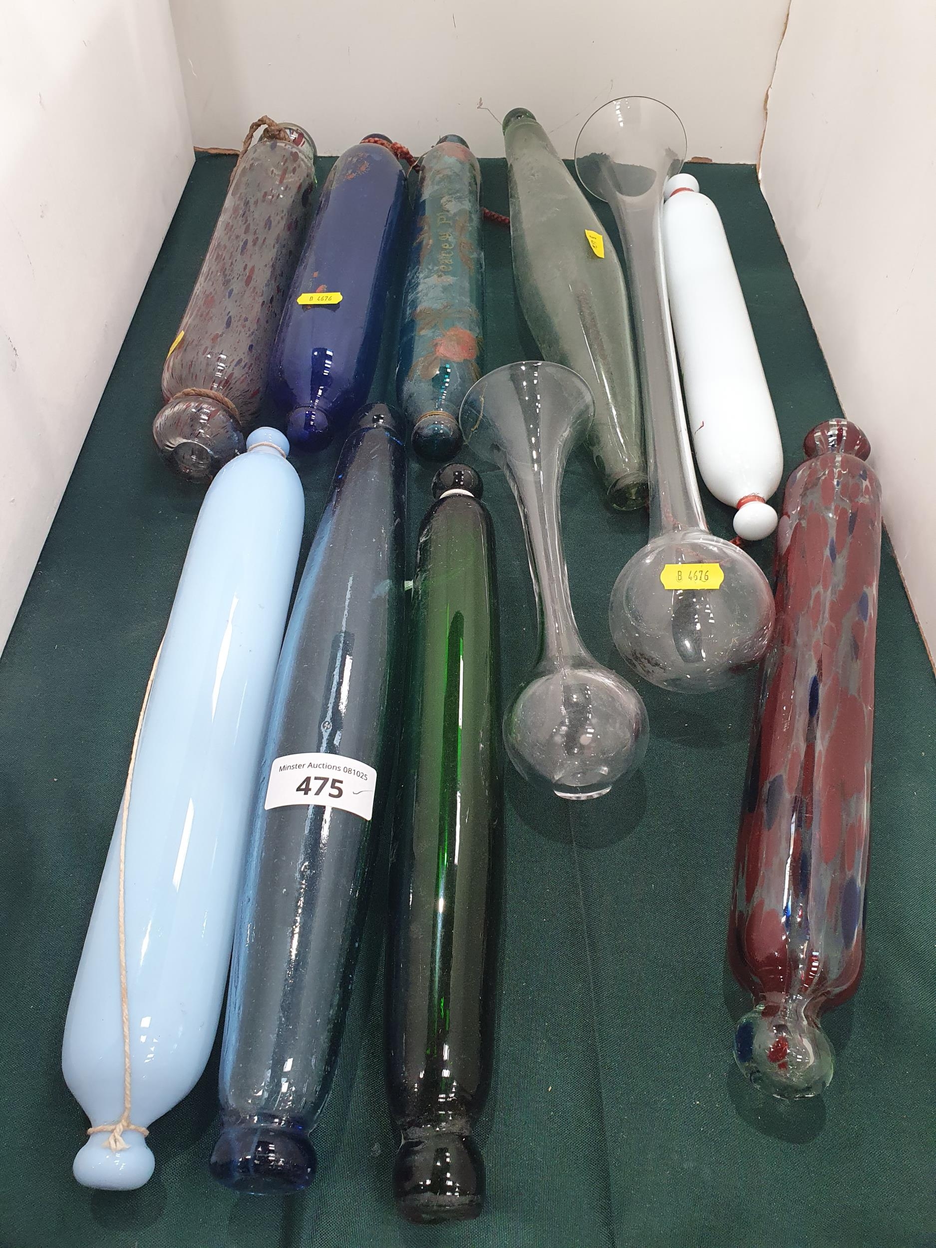 A selection of coloured glass Rolling Pins, some with gilded decoration ...