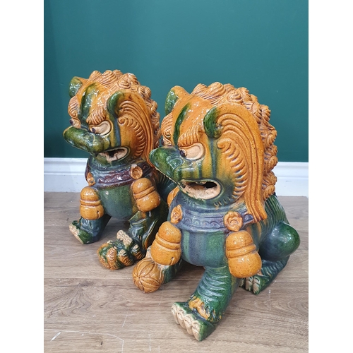 A pair of glazed Chinese Dogs of Fo Garden Figures, (Some chips to ...