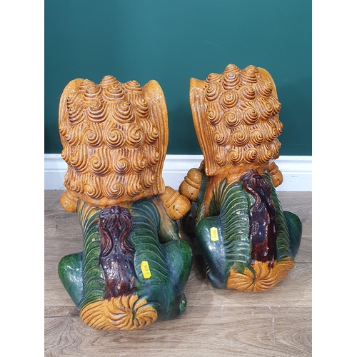 A pair of glazed Chinese Dogs of Fo Garden Figures, (Some chips to ...