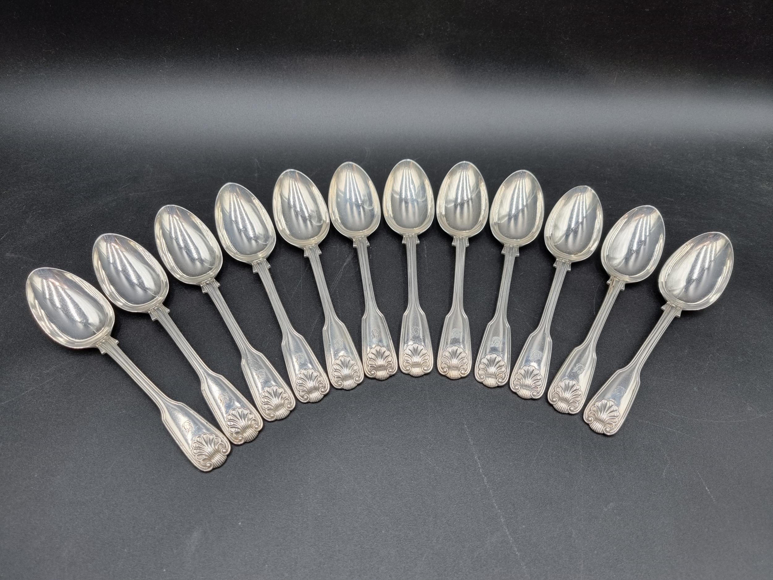 One dozen Victorian silver Dessert Spoons fiddle, thread and shell ...