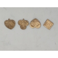 A set of four Victorian gilt metal Whist Tokens with registration ...