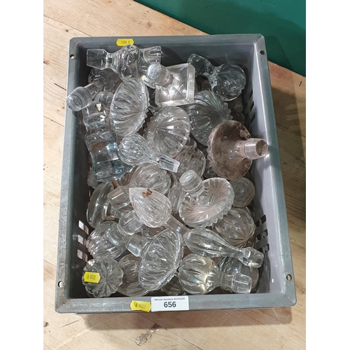 Two crates of glass bottle stoppers.