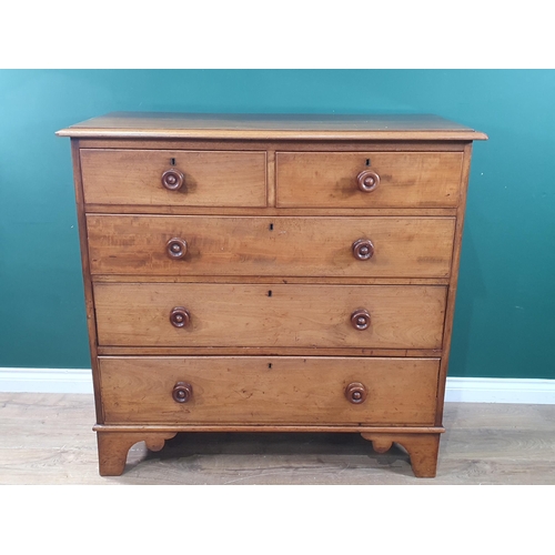 A satinwood Chest of two short over three long Drawers raised on shaped ...