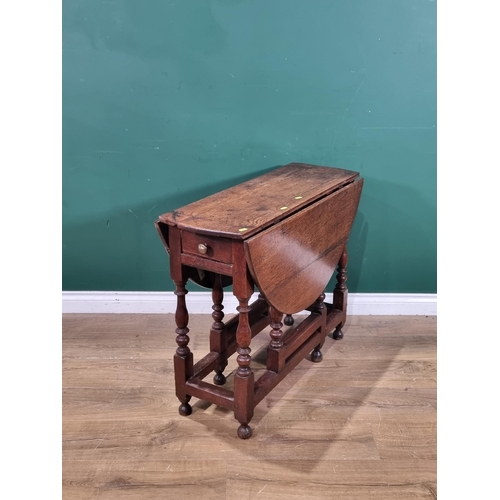 A small oak Gateleg Table with oval top, single fitted drawer and ...