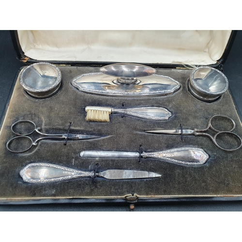 A George V silver mounted Manicure Set, Birmingham 1919, in case