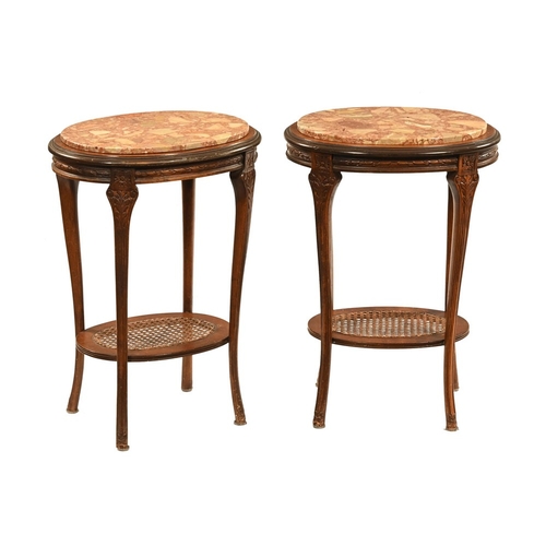 A pair of continental style oval marble topped occasional tables, with ...