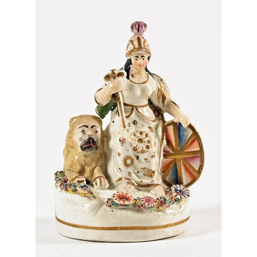 A Staffordshire figure of Britannia, with shield and lion. Height 16 cm.