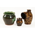 Three pieces of Wetheriggs pottery Penrith, a salt pig, jar and cover ...