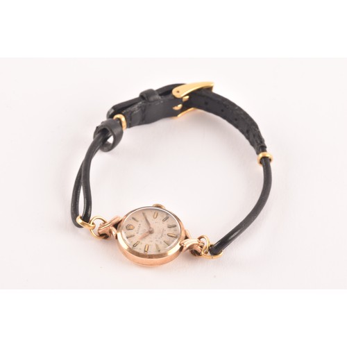 A ladies 9ct yellow gold Rolex wristwatch, the round silvered dial with ...