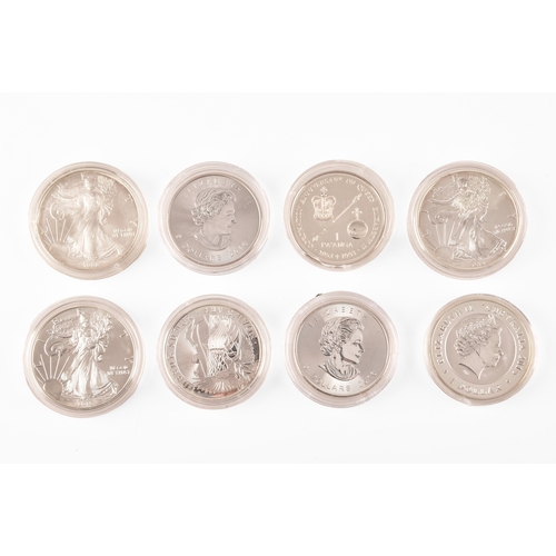 A collection of silver coins, including three US 1oz fine silver one ...