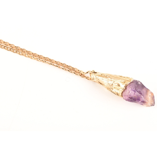 A 9ct gold tiger eye link chain, 68 cm long, suspended with a yellow ...