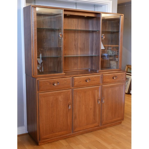 Ercol - elm display cabinet; two glazed doors flanking glass shelves ...