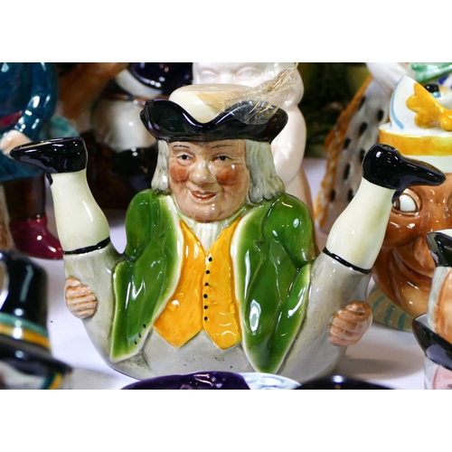 A large collection of mid 20th century Toby character jugs, vases ...