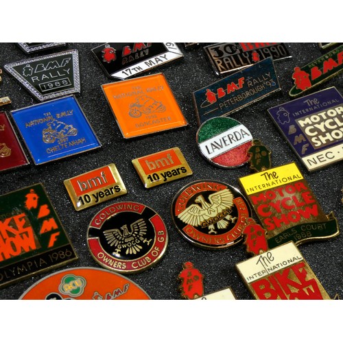 A collection of mainly motorcycle related enamel and metal lapel badges ...