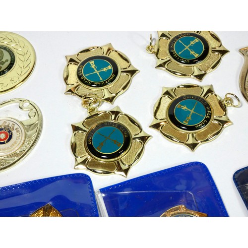 A collection of modern small bore rifle shooing badges from Driffield ...