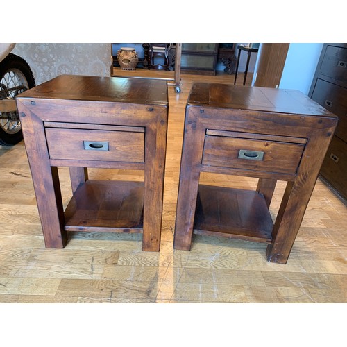A pair of dark stained pine side tables, hidden pull out shelf over a ...