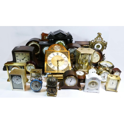 A collection of early 20th century and later clocks, to include ...