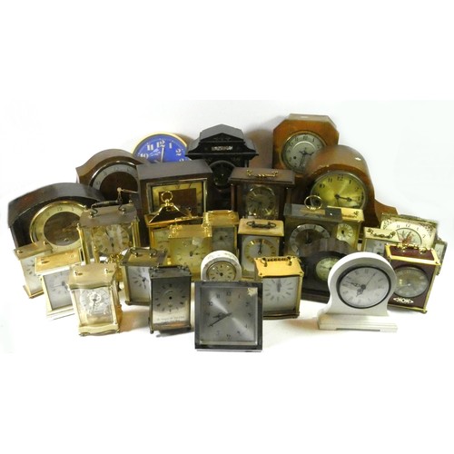 A collection of early 20th century and later mantel clocks, having ...