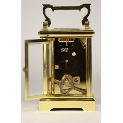 An English Wellington carriage clock with enameled dial and Roman ...