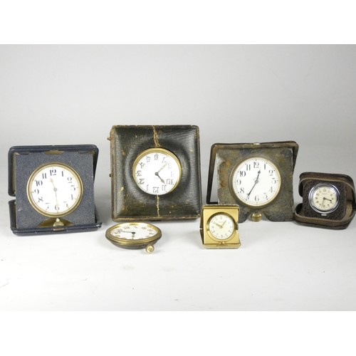Four 1920s/30s 8 day traveling clocks, together with two 1950s/60s ...