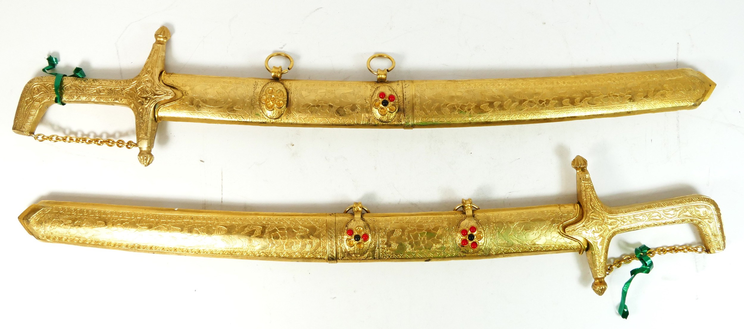 A pair of souvenir short sword/daggers from Saudi Arabia, gilt metal ...